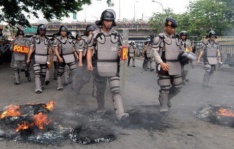 Indonesian Antiriot Police Walks Past Burning Editorial Stock Photo ...