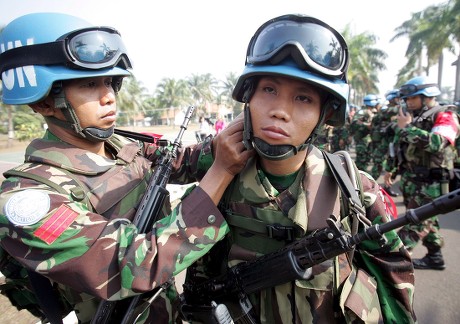 Indonesian Soldier Adjusts His Friends Helmet Editorial Stock Photo ...