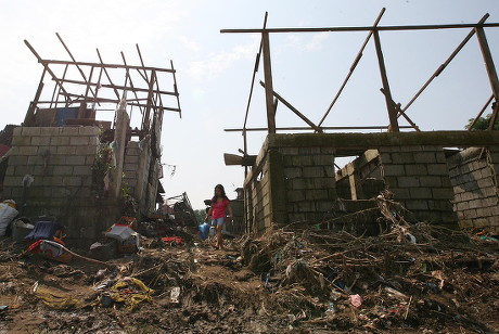 Filipino Walks Between Houses Damaged By Editorial Stock Photo - Stock ...
