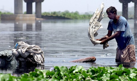 Indian Washerman Washes Clothes On Bank Editorial Stock Photo - Stock ...