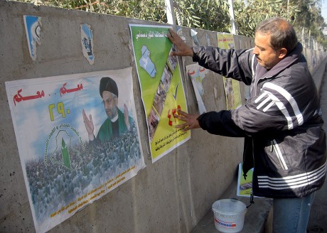 Iraqi Man Pastes Election Campaign Posters Editorial Stock Photo ...