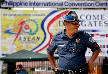 Filipino Policeman Stands Before Asean Banner Editorial Stock Photo ...