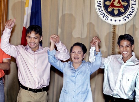 Philippine President Gloria Macapagalarroyoc Raises Hands Editorial ...