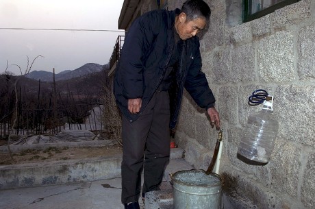 Villager Gets Drinking Water Outside His Editorial Stock Photo - Stock ...