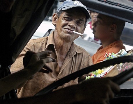 Filipino Vendor Smokes His Own Cigarette Editorial Stock Photo - Stock ...
