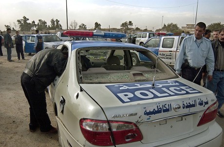 Iraqi Policeman Peeks Into Police Car Editorial Stock Photo - Stock ...