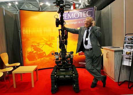 Exhibitor Leaning Against Unmanned Security Vehicle Editorial Stock ...