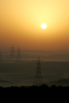 View Power Lines Silouetted Against Sunrise Editorial Stock Photo ...