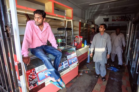 Pakistani Shop Owner Sits Inside His Editorial Stock Photo - Stock ...