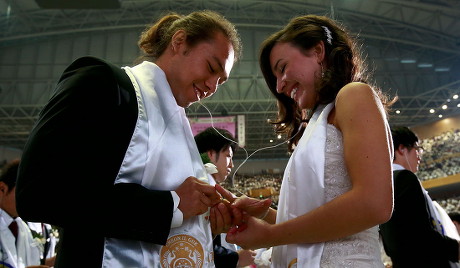 Bridal Couple Exchanges Wedding Rings During Editorial Stock Photo ...