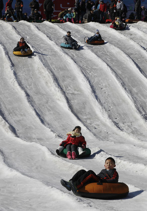 Visitors Ride Rubber Sleds Going Down Editorial Stock Photo - Stock ...