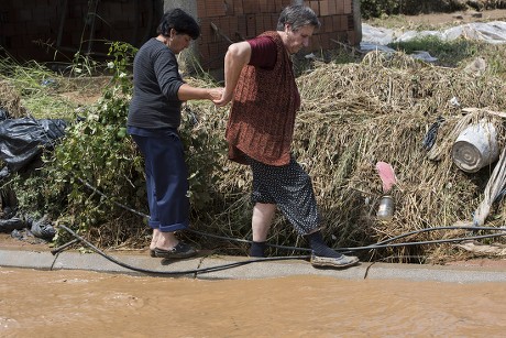 Two Women Try Pass Flooded Street Editorial Stock Photo - Stock Image ...