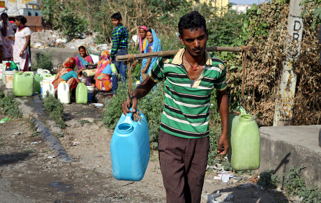 Indian Man Carries Containers Filled Drinking Editorial Stock Photo ...