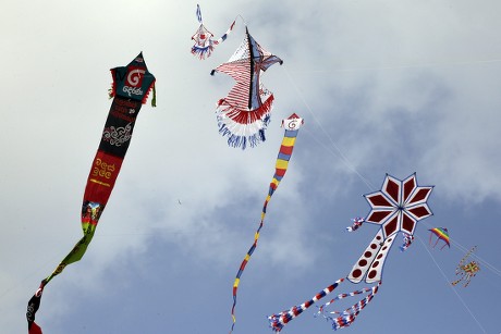 Colorful Uniquely Shaped Kites Fly During Editorial Stock Photo - Stock ...