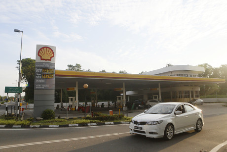 Car Drives Past Shell Gas Station Editorial Stock Photo - Stock Image ...