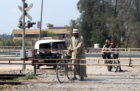 Man Crosses Closed Railroad Crossing Near Editorial Stock Photo - Stock ...
