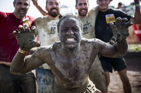 Competitors Overcome Obstacle During First Mud Editorial Stock Photo ...