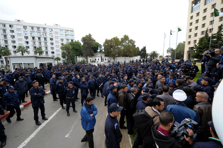 Algerian Policeman Holds Placard Saying Arabic Editorial Stock Photo ...