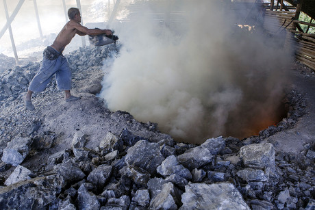 Indonesian Worker Throws Limestone Into Burning Editorial Stock Photo ...