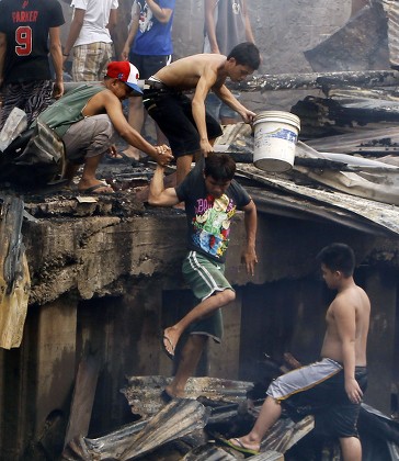 Filipino Residents Lift Victim Following Fire Editorial Stock Photo ...