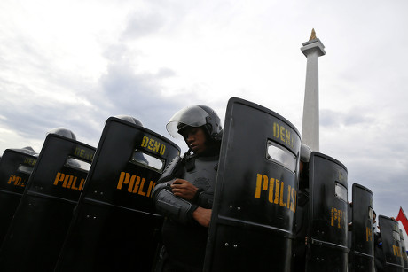Indonesian Police Officer C Prepares His Editorial Stock Photo - Stock ...