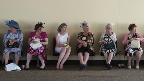 Racegoers Rest Their Feet On Ladies Editorial Stock Photo - Stock Image ...