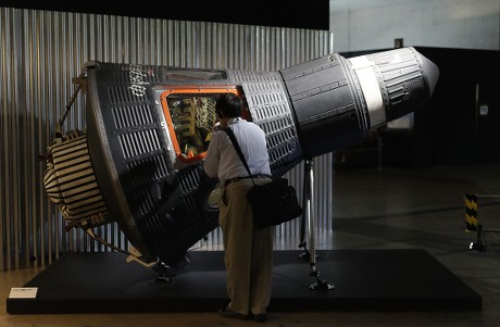 Visitor Inspects Replica Mercury Spacecraft During Editorial Stock ...