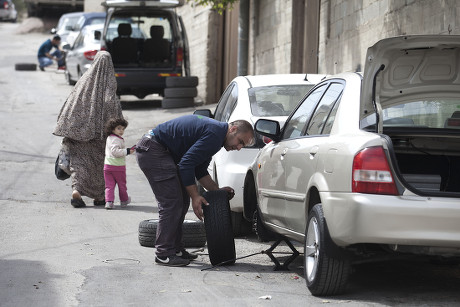 Palestinian Man Replaces Flat Tire East Editorial Stock Photo - Stock ...