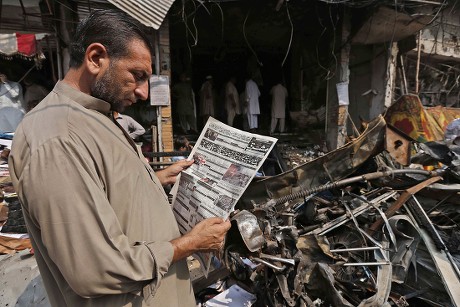 Man Reads Front Page News Bomb Editorial Stock Photo - Stock Image ...