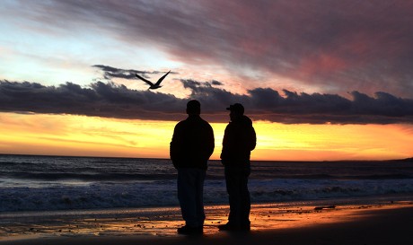 Two Men Watch Sunset Over Pacific Editorial Stock Photo - Stock Image ...