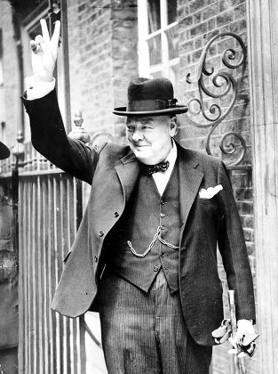 1 Sir winston churchill gives his famous v for victory salute to people ...