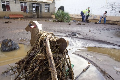 Three Volunteers Clean Mud That Fills Editorial Stock Photo - Stock ...