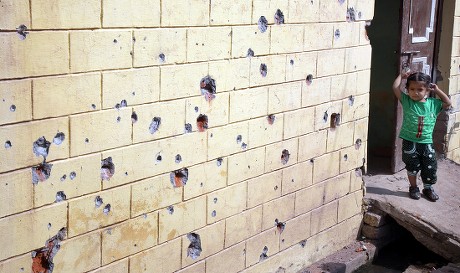 Indian Child Stands Near Pockmarked Wall Editorial Stock Photo - Stock ...