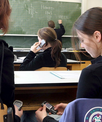 Two Students Use Their Mobile Phones Editorial Stock Photo - Stock ...