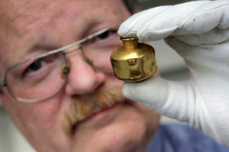 Archaeologist Michael Muellerkarpe Holds Small Golden Editorial Stock ...