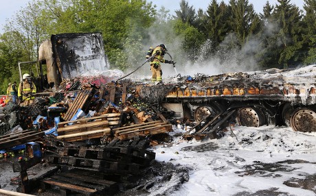 Fire Fighters Extinguish Burning Truck On Editorial Stock Photo - Stock ...
