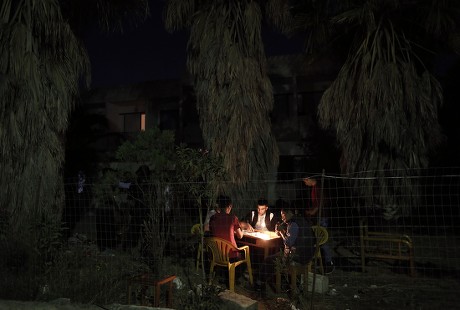 Afghan Refugees Play Cards Under Light Editorial Stock Photo - Stock ...