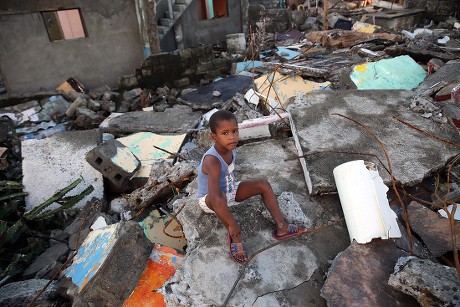 Child Sits Amid Devastation Caused By Editorial Stock Photo - Stock ...