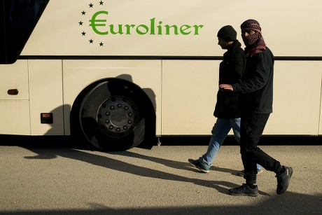 Migrants Walk Past Bus On Greek Editorial Stock Photo - Stock Image ...