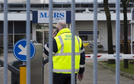 Security Guard Uses His Mobile Phone Editorial Stock Photo - Stock ...