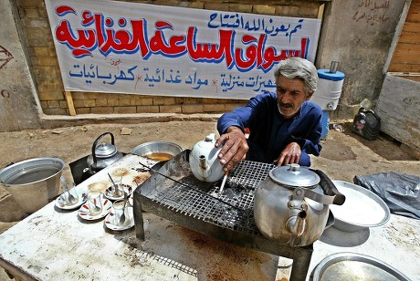Iraqi Tea Seller Lights His Cigarette Editorial Stock Photo - Stock ...
