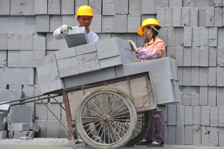 Migrant Workers Load Building Materials On Editorial Stock Photo ...