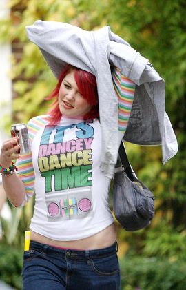 26 Holding jacket over head Stock Pictures, Editorial Images and Stock ...