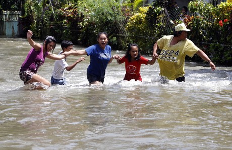 Filipino Villagers Wade Through Flooded Waters Editorial Stock Photo - Stock Image | Shutterstock