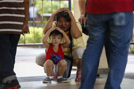 Filipinos Sit Cover Their Heads During Editorial Stock Photo - Stock ...