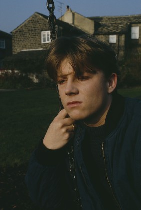 Nick Sitting On Swings Thinking Alice Editorial Stock Photo - Stock ...