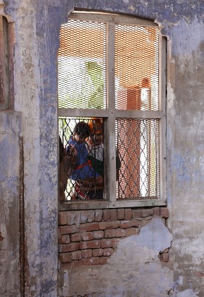 People Peer Through Windows Martyrs Well Editorial Stock Photo - Stock ...