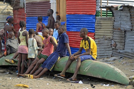 Liberians Sit On Canoe Watch Beach Editorial Stock Photo - Stock Image ...