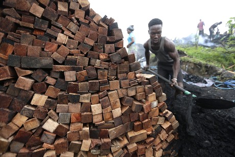 Woman Works Charcoal Factory Near Abidjan Editorial Stock Photo - Stock ...