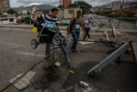 Man Lifting Stroller Makes His Way Editorial Stock Photo - Stock Image ...